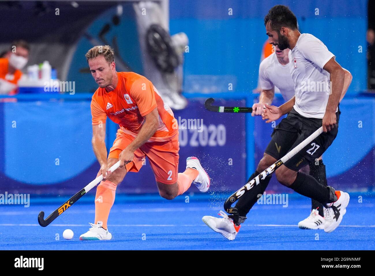 TOKYO, JAPAN - JULY 27: Jeroen Hertzberger of the Netherlands and Sukhpal Singh Panesar of ...