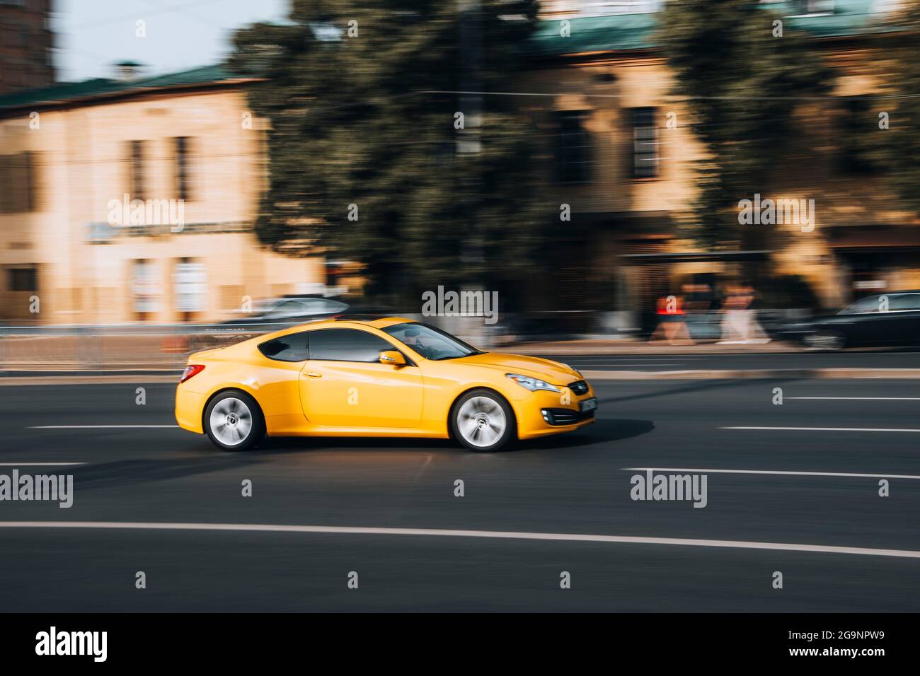 Ukraine, Kyiv - 16 July 2021: Yellow Hyundai Genesis Coupe car moving ...