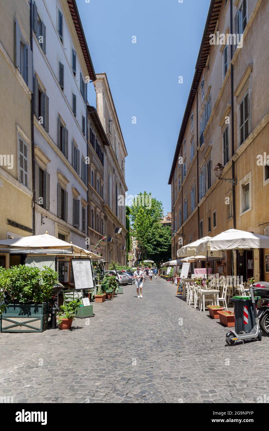 Narrow ancient alley with cobblestone in the historic center of Rome ...