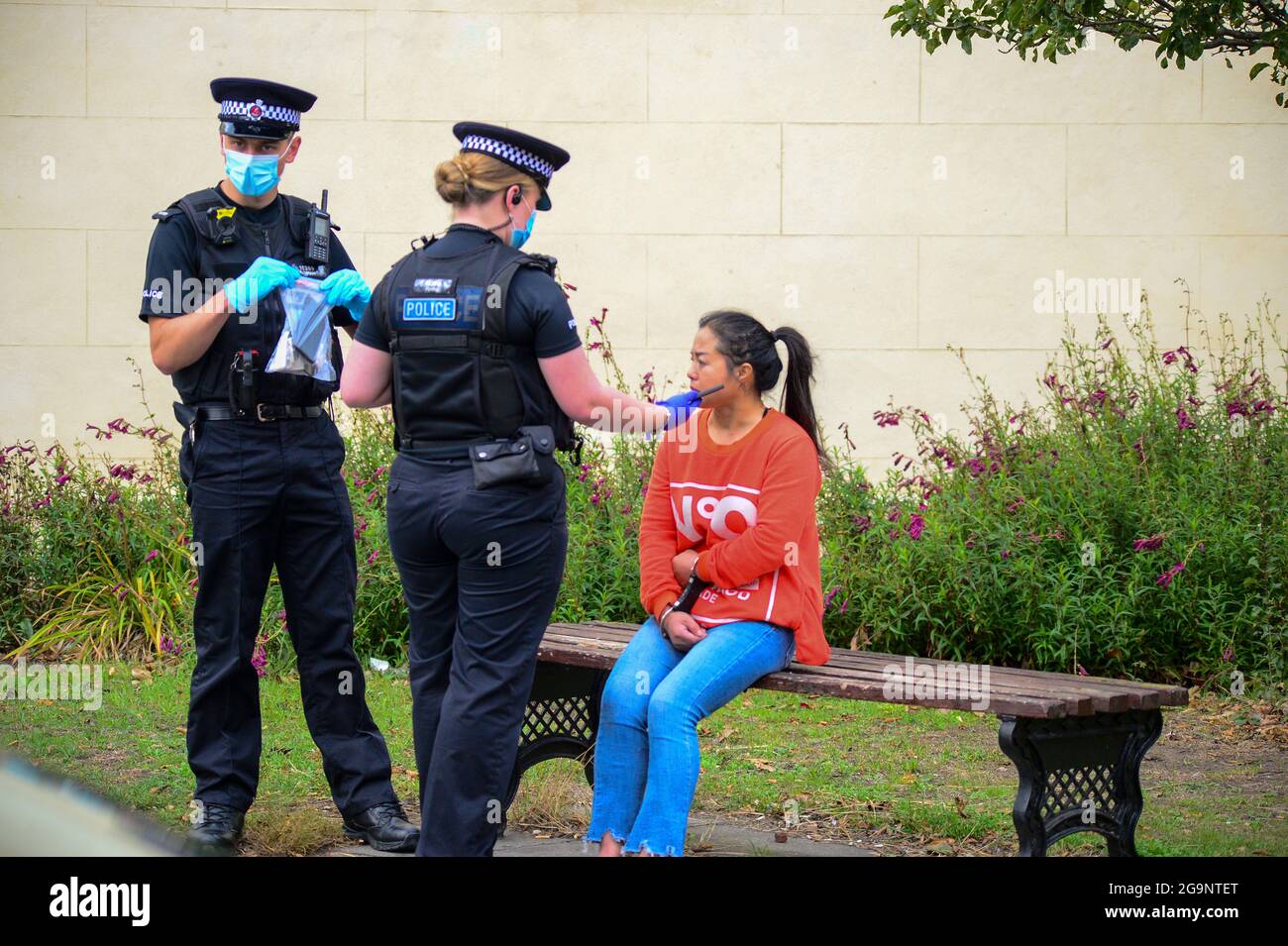 Arrested handcuffs woman hi-res stock photography and images - Alamy