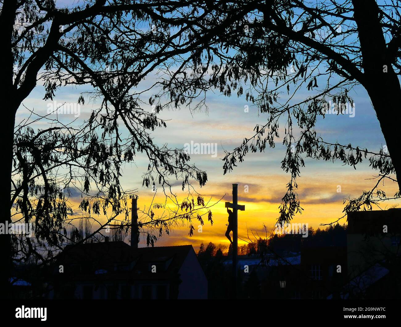 Silhouette of Jesus on a cross during sunset Stock Photo - Alamy