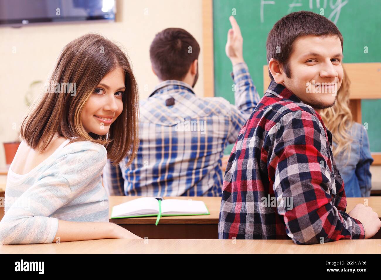 Group of students sitting in classroom Stock Photo - Alamy