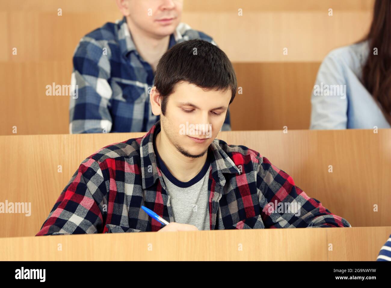 Group of students sitting in classroom Stock Photo - Alamy