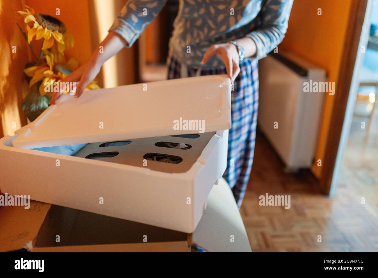 Woman opening box of food hi-res stock photography and images - Alamy