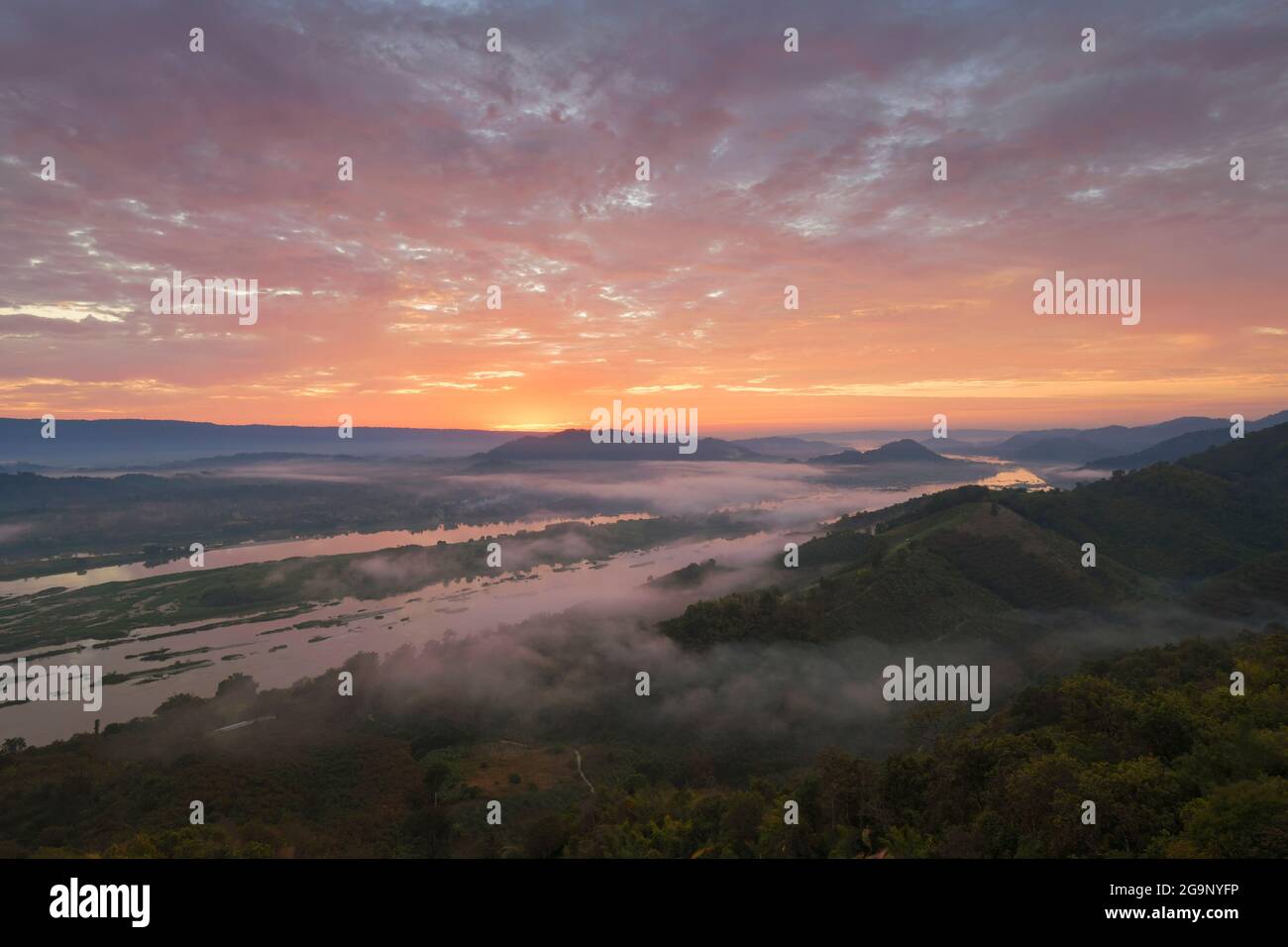 Cumulus sunset clouds with sun setting down Stock Photo - Alamy