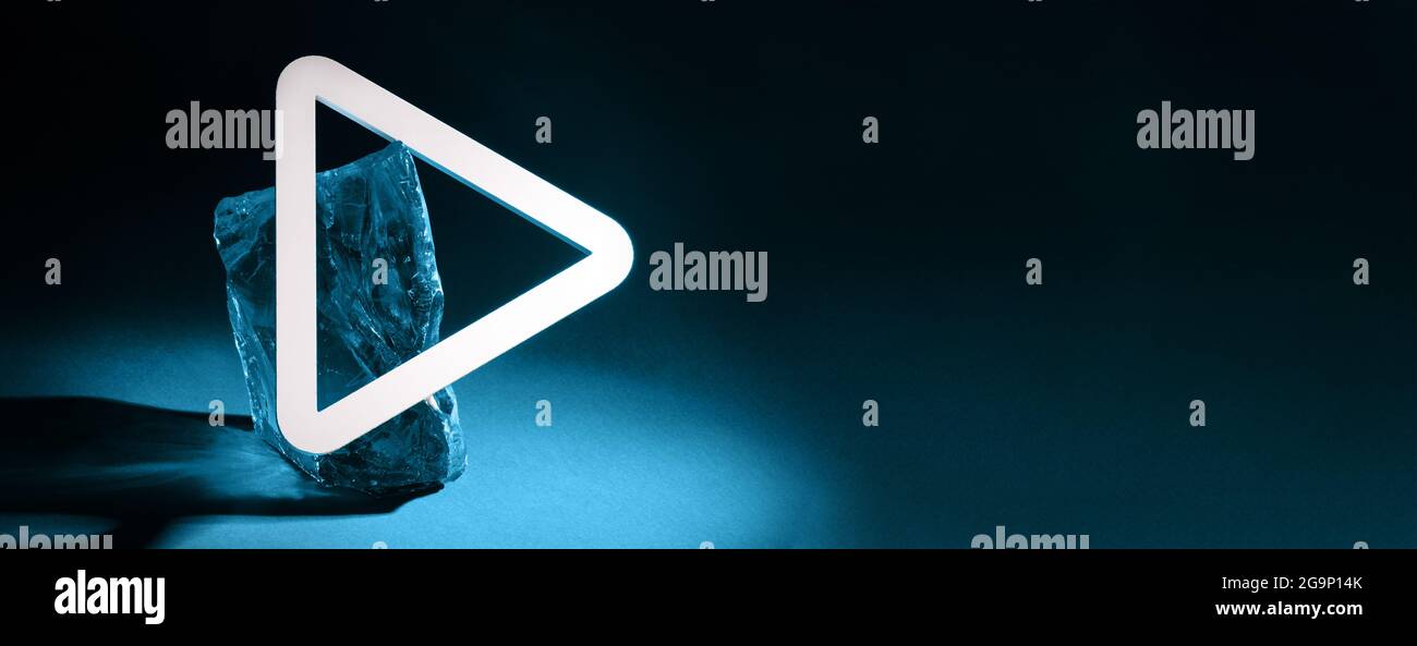 Play button sign over dark blue background, panoramic layout with space ...