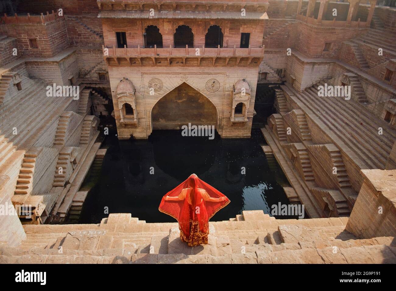 Women in saris carrying water at step well, Jaipur, Rajasthan, India ...