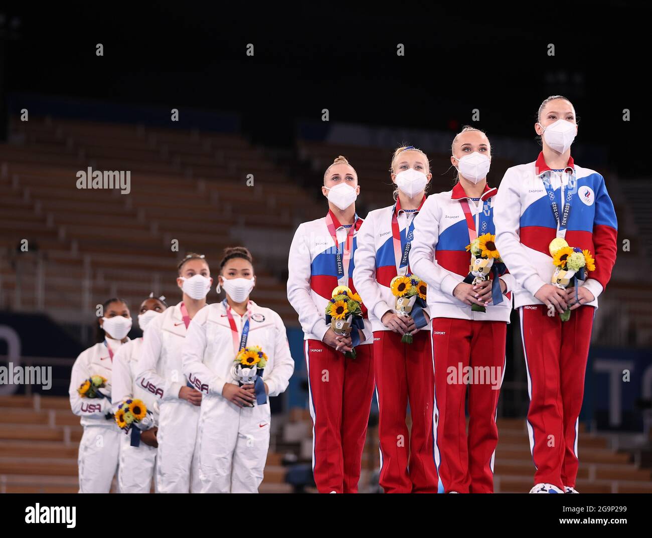 Tokyo, Japan. 27th July, 2021. Gymnasts of ROC (R) pose during the ...