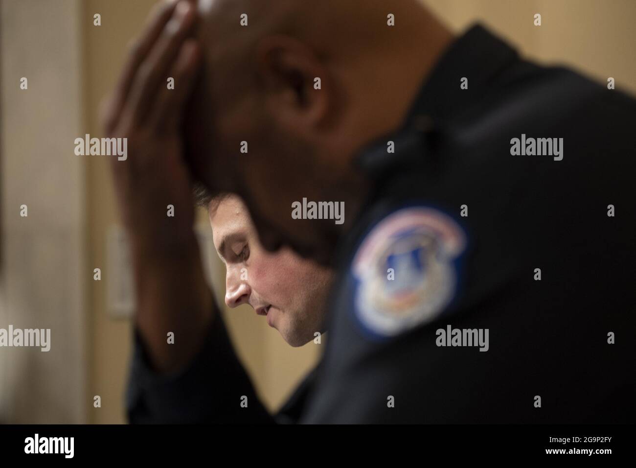 Harry Dunn, private first class of the U.S. Capitol Police, listens ...