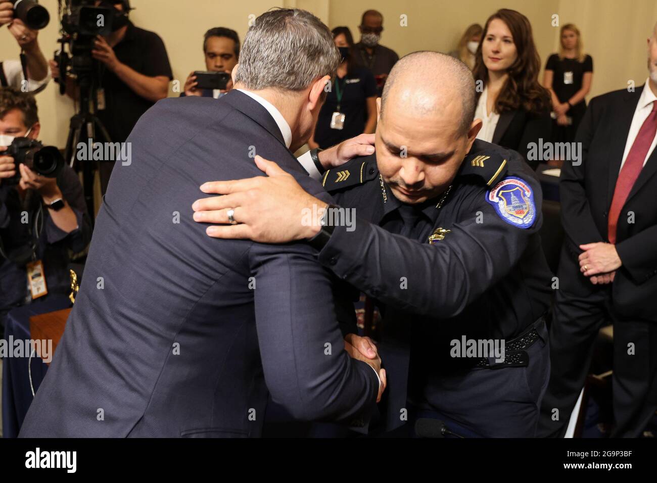 Representative Adam Kinzinger, R-IL, embraces Sgt. Aquilino Gonell as ...