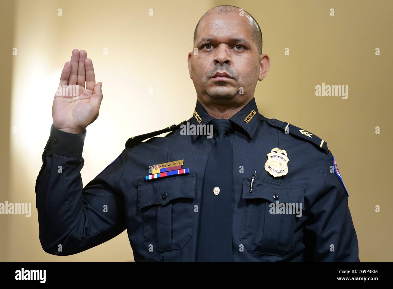 U.S. Capitol Police Sgt. Aquilino Gonell is sworn in to testify to the ...