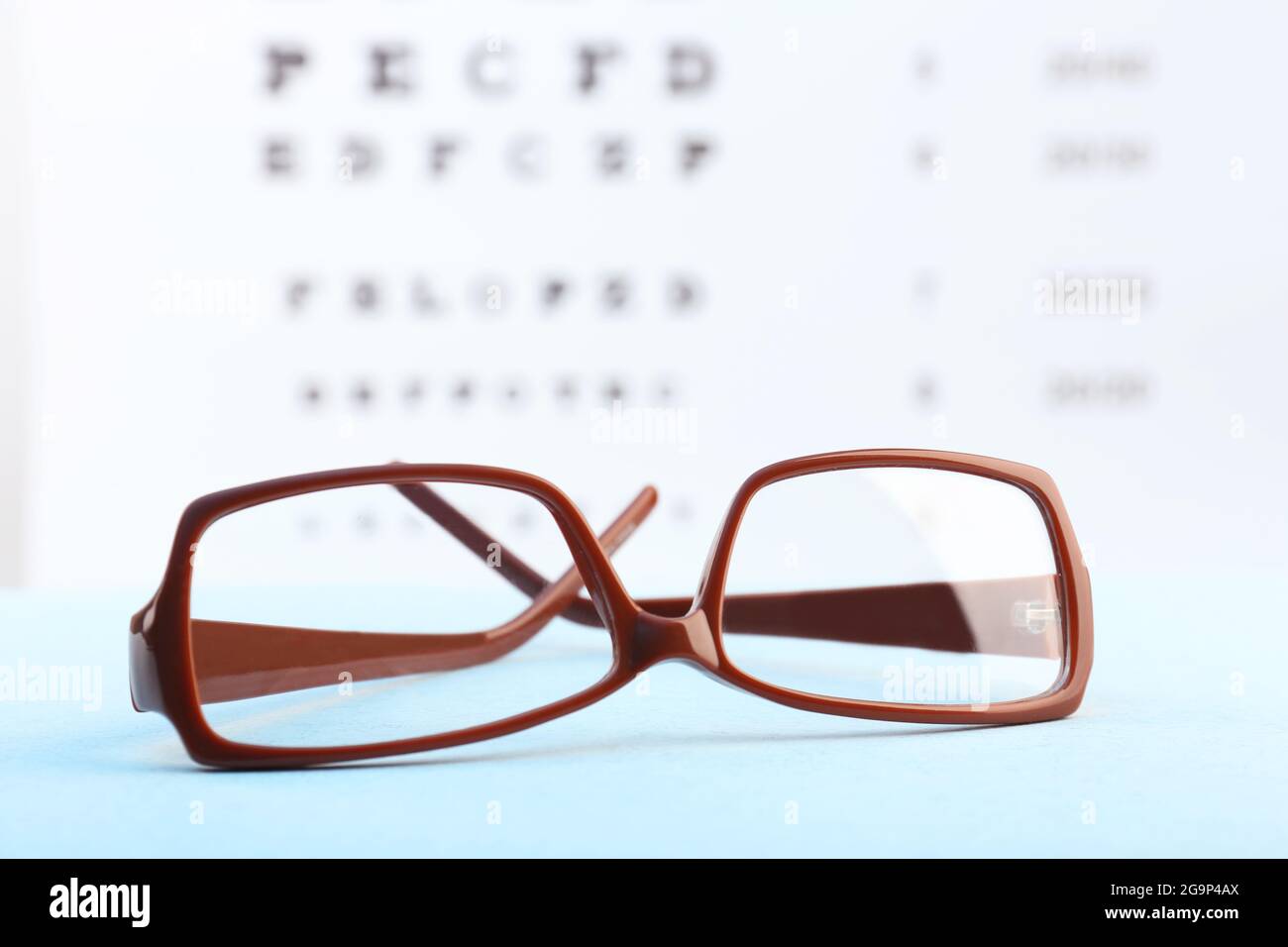Eye glasses on eyesight test chart background Stock Photo - Alamy