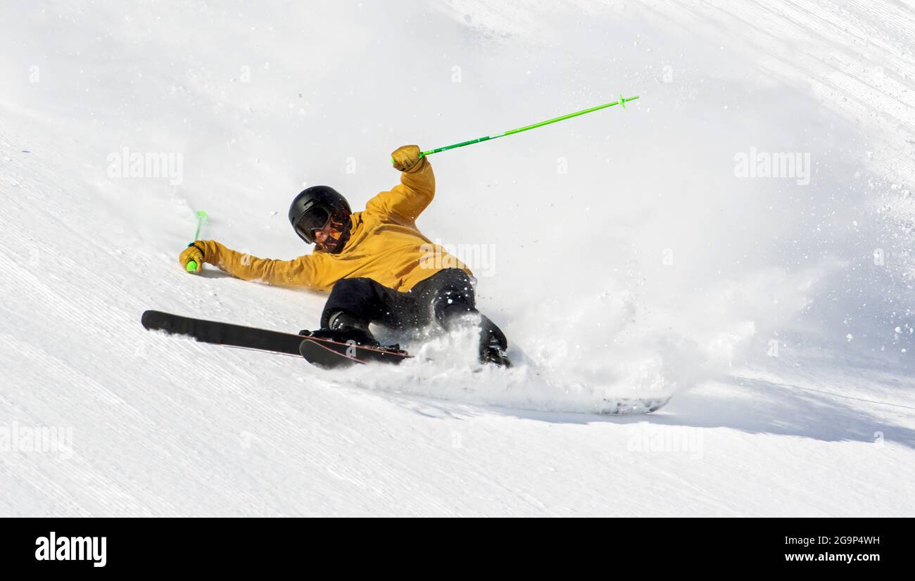 fall with skis on the slope Stock Photo - Alamy