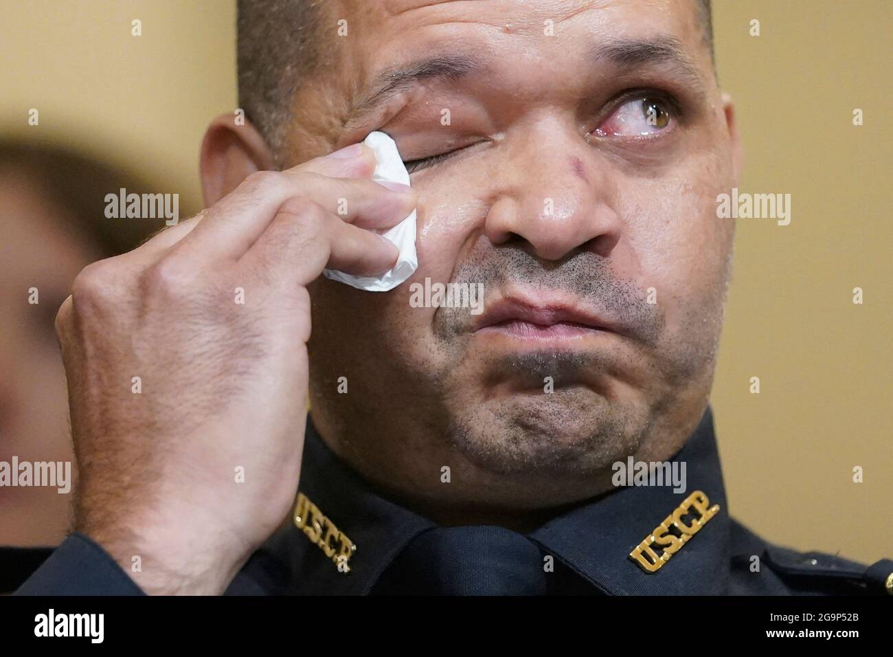 U.S. Capitol Police Sgt. Aquilino Gonell wipes his eyes during the ...