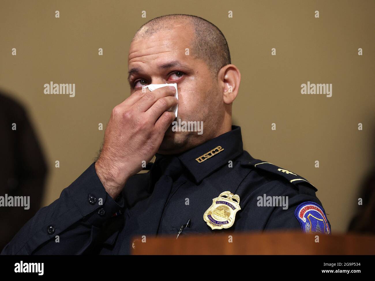 Capitol Police officer Sgt. Aquilino Gonell becomes emotional as he ...