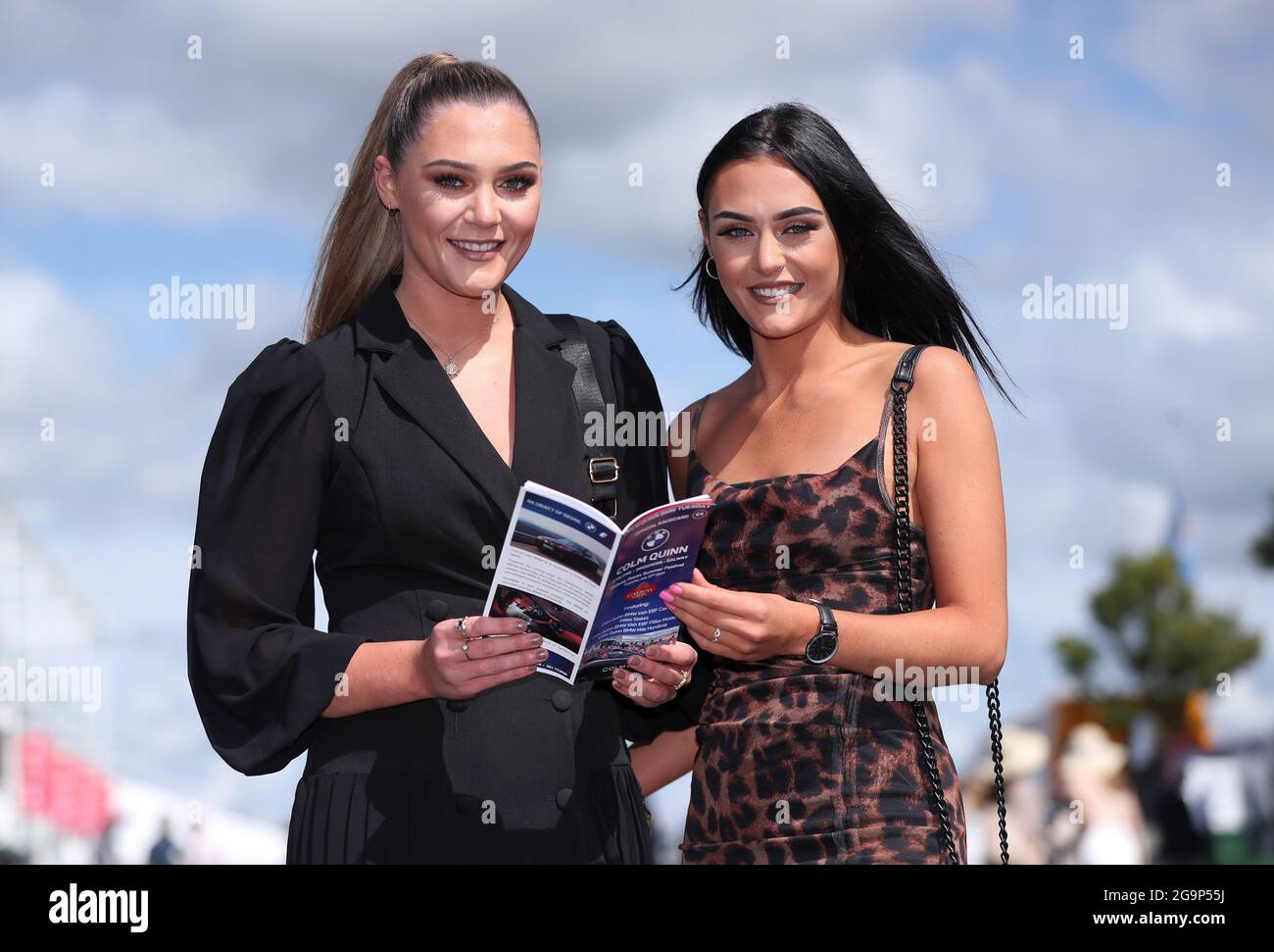 Racegoers Michelle Prendergast (left) with twin sister Caira during day ...