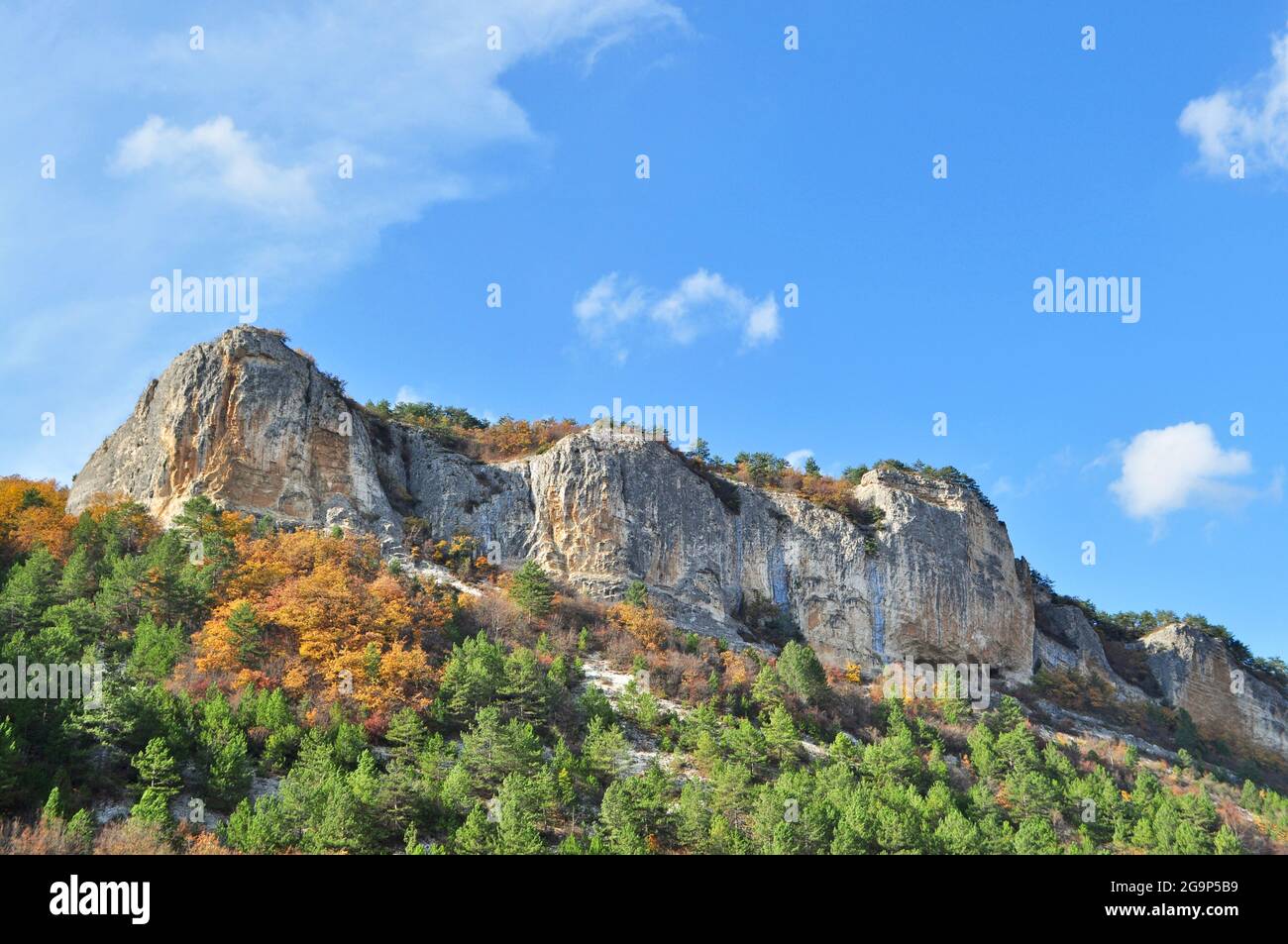Breathtaking view of rocks covered with bright colourful autumn forest ...