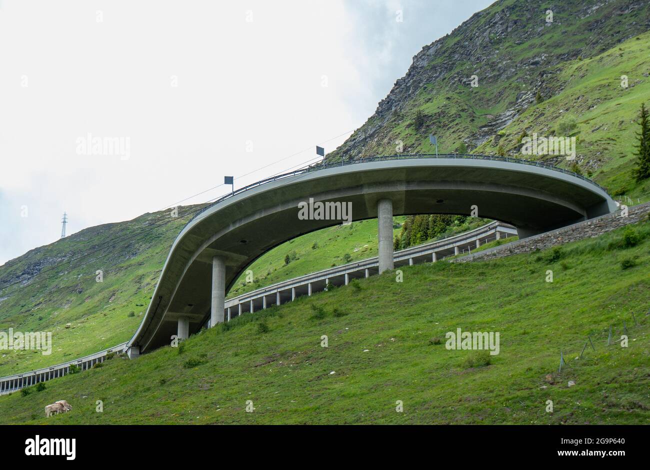 A bridge, a bend, and a gallery on Gotthard motorway pass street ...