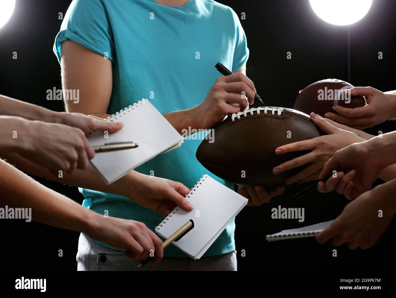 Autographs by American football star on black and lights background ...