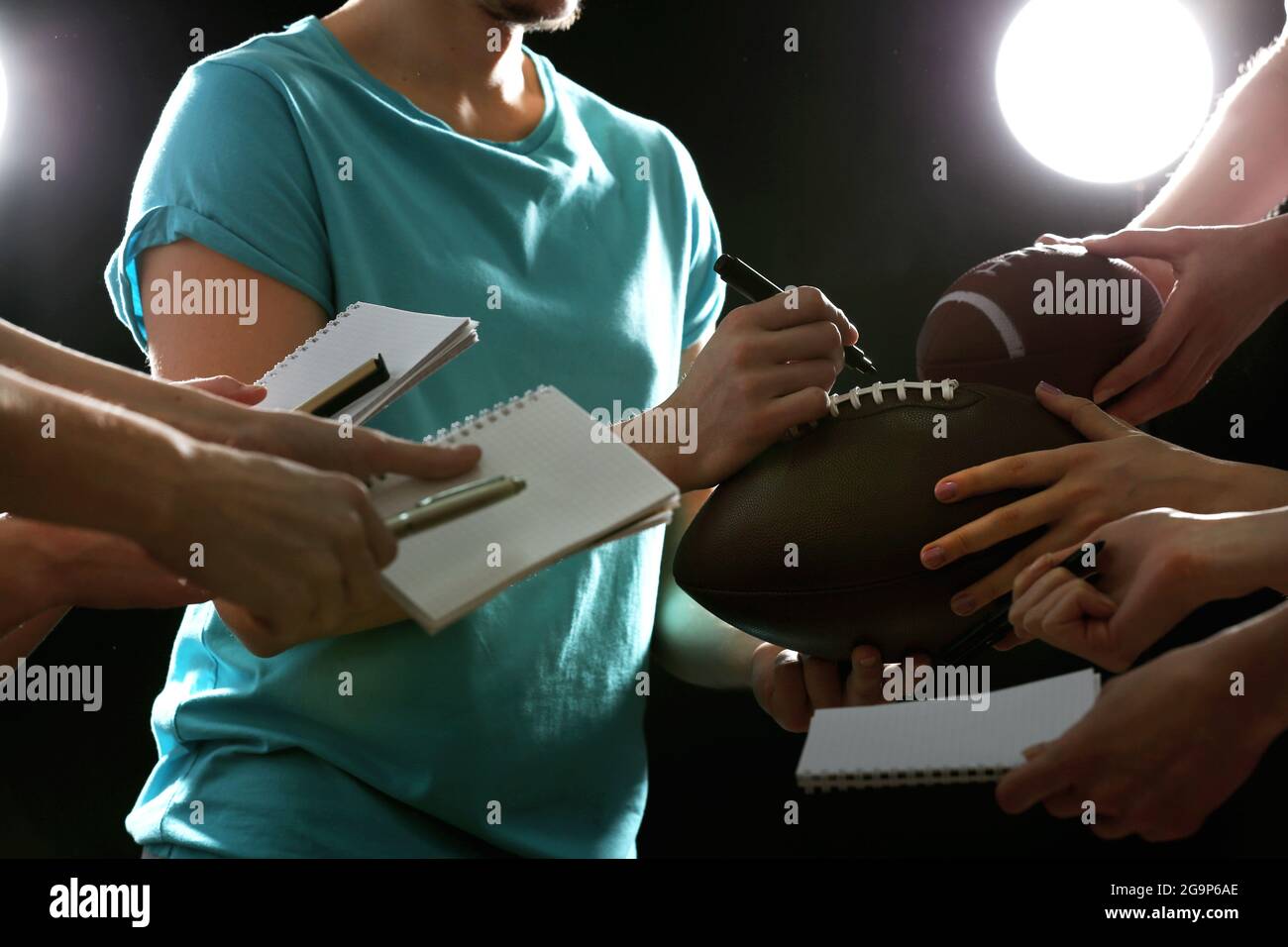 Autographs by American football star on black and lights background ...