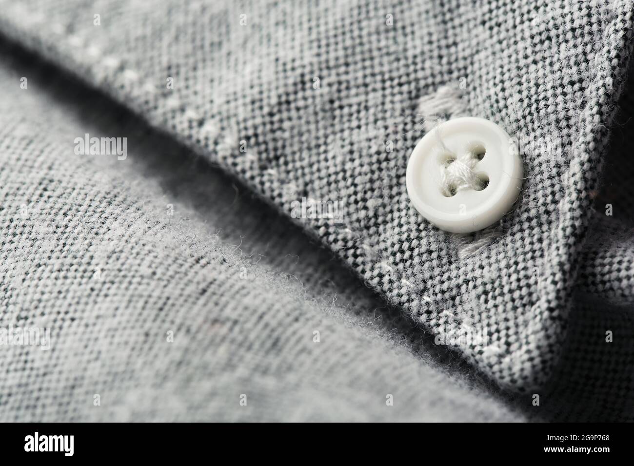 Button on clothes close up Stock Photo - Alamy