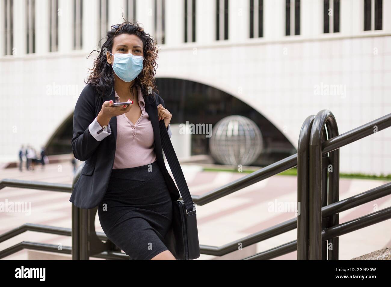 Stylish young latina woman with face mask. Enterprising person on a ...