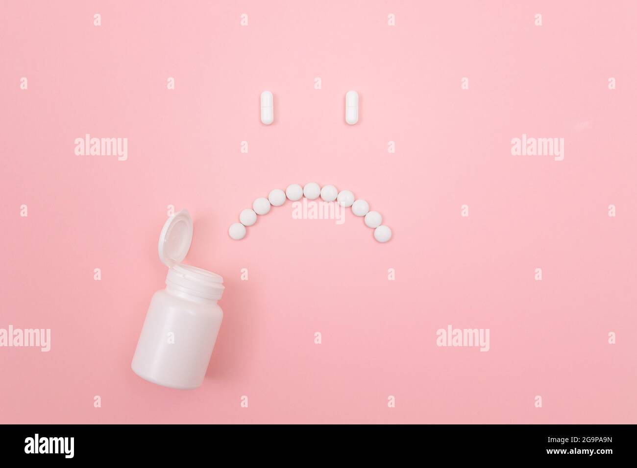 Pharma Harm. Sad Smiley Face Made from White Pills, Lying on Pink ...