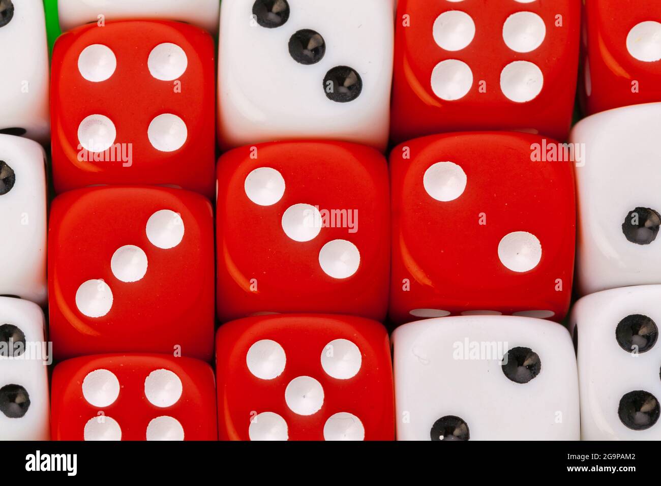 Rolling dice on a wooden desk Stock Photo - Alamy