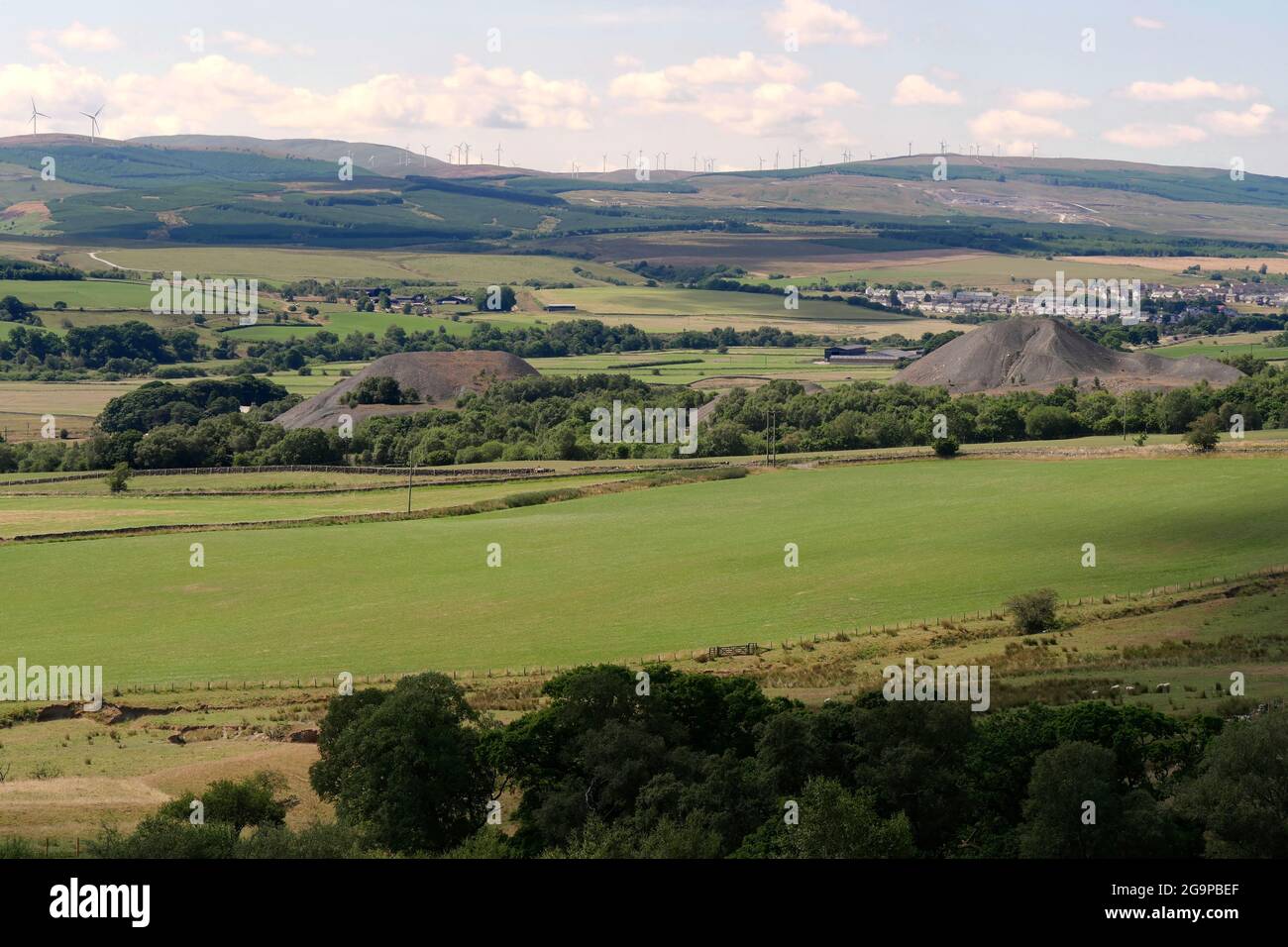 coal bings, slag heaps, and rolling hills of the Southern Uplands ...