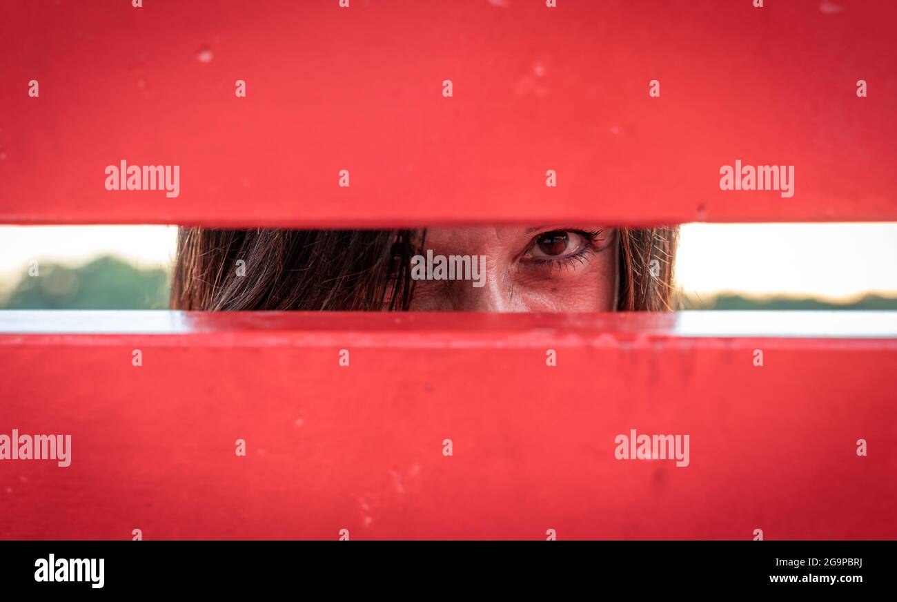 Eye looking through slot hi-res stock photography and images - Alamy
