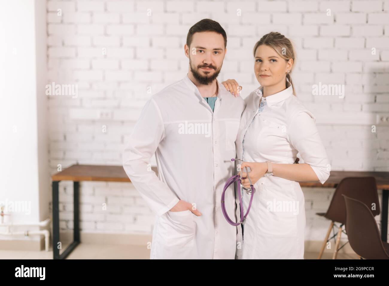Portrait of two confident successful professional doctors wearing ...