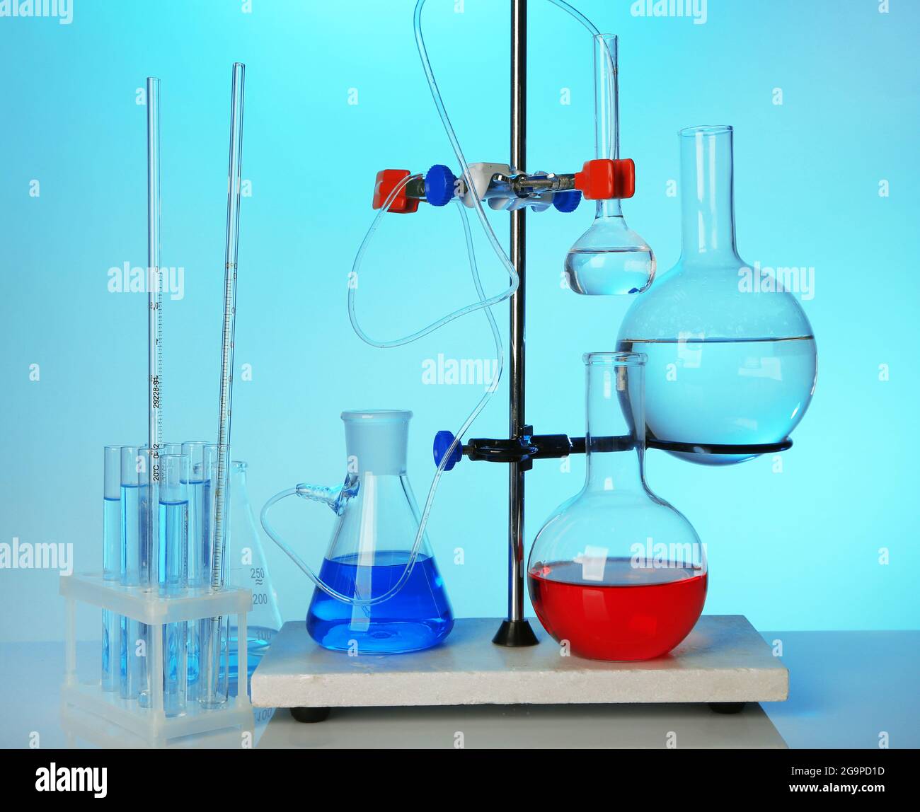 Fixed laboratory glassware on support on colorful background Stock ...