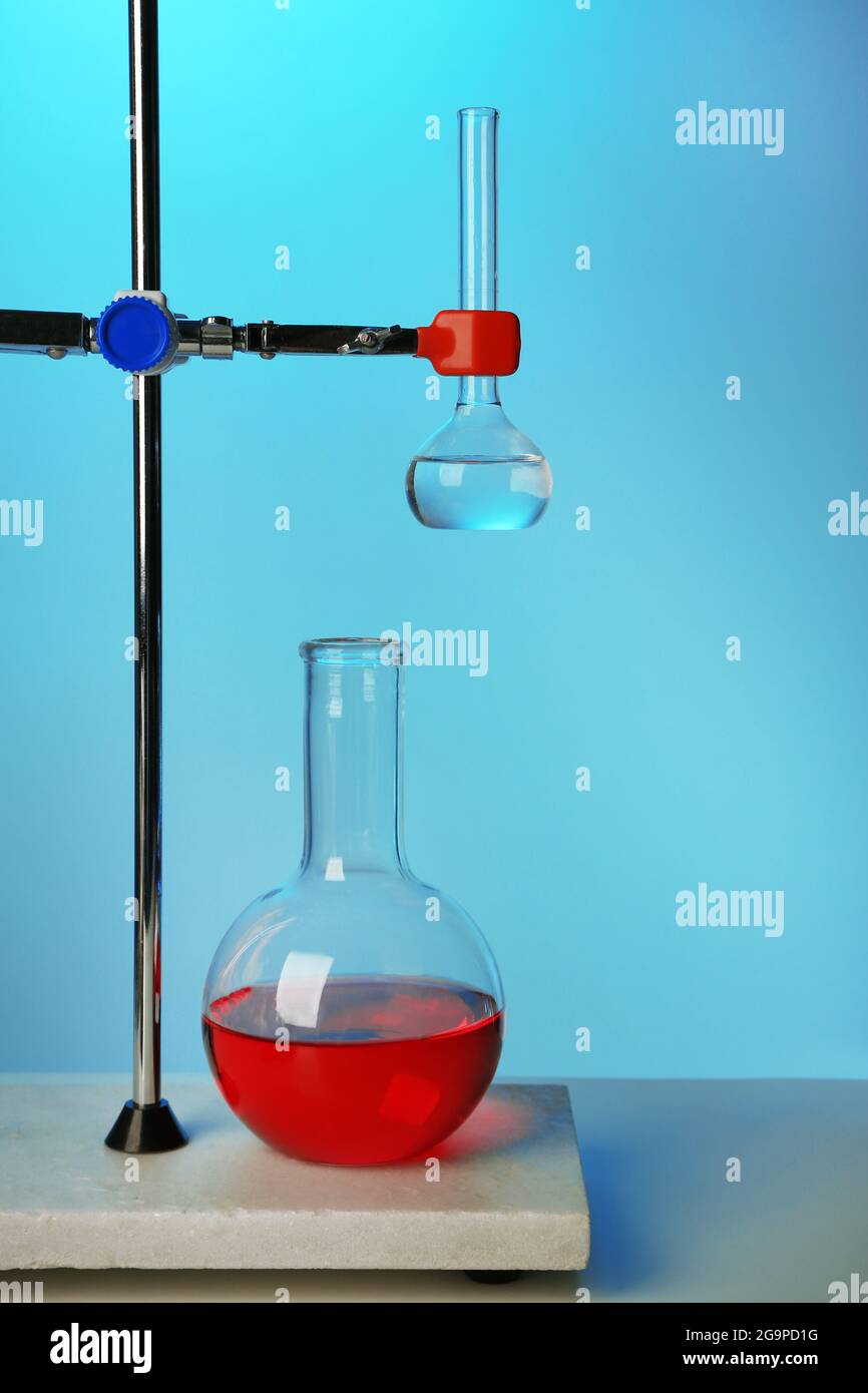Fixed laboratory glassware on support on colorful background Stock ...
