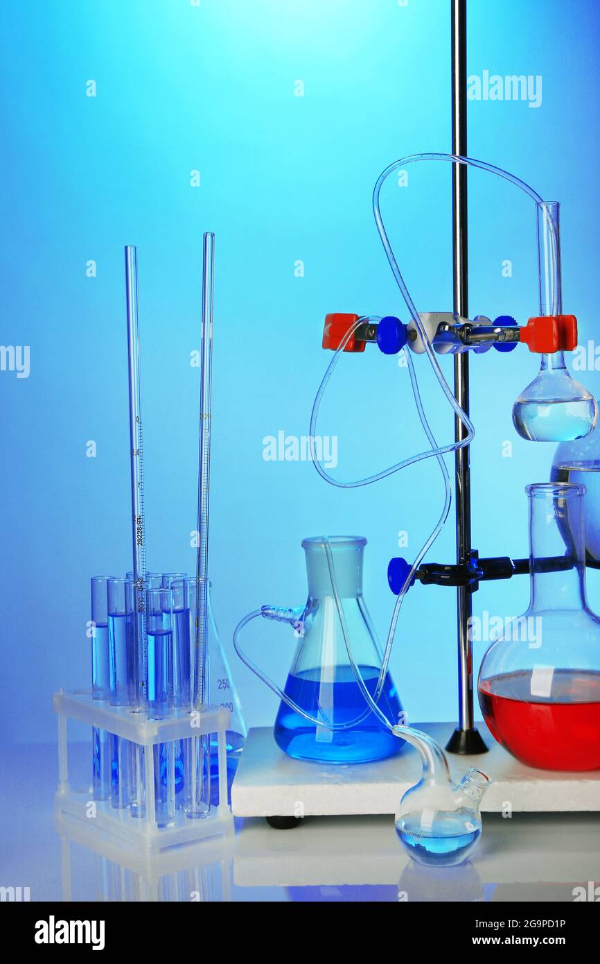 Fixed laboratory glassware on support on colorful background Stock ...
