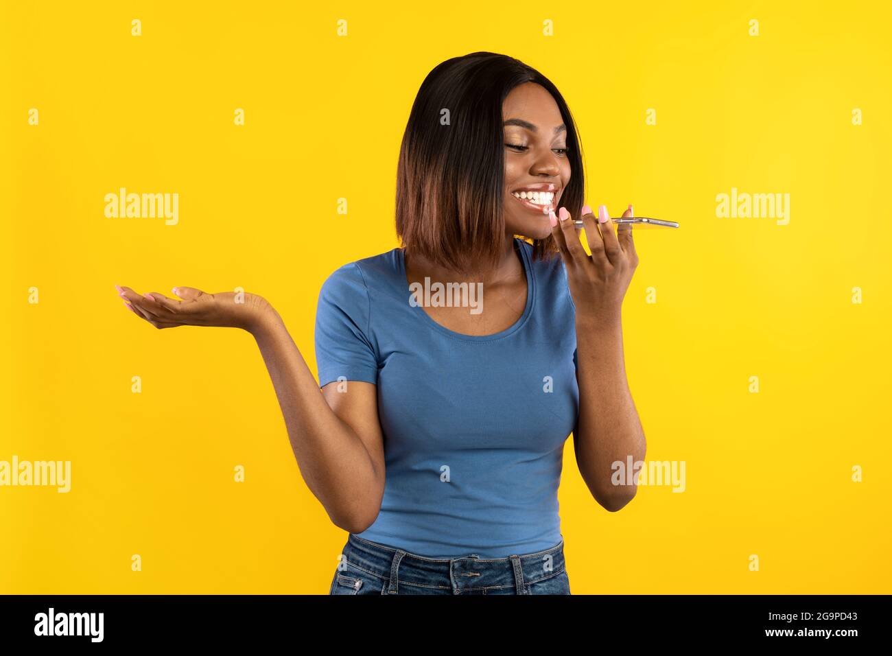 African American Woman Using Voice Search On Phone, Yellow Background ...