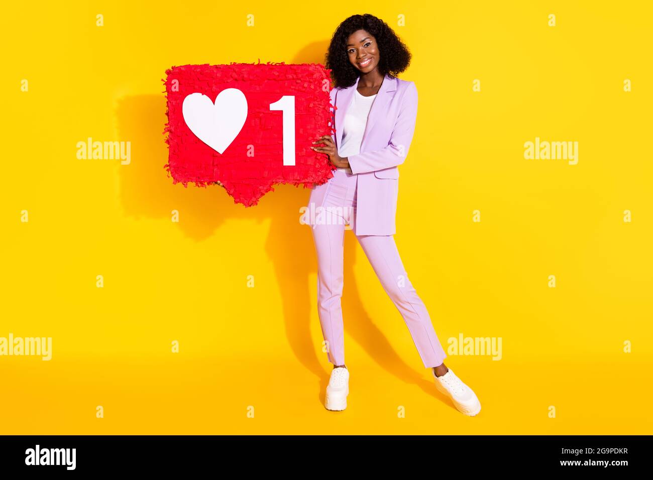 Full size photo of young happy afro girl hold demonstrate hug like ...