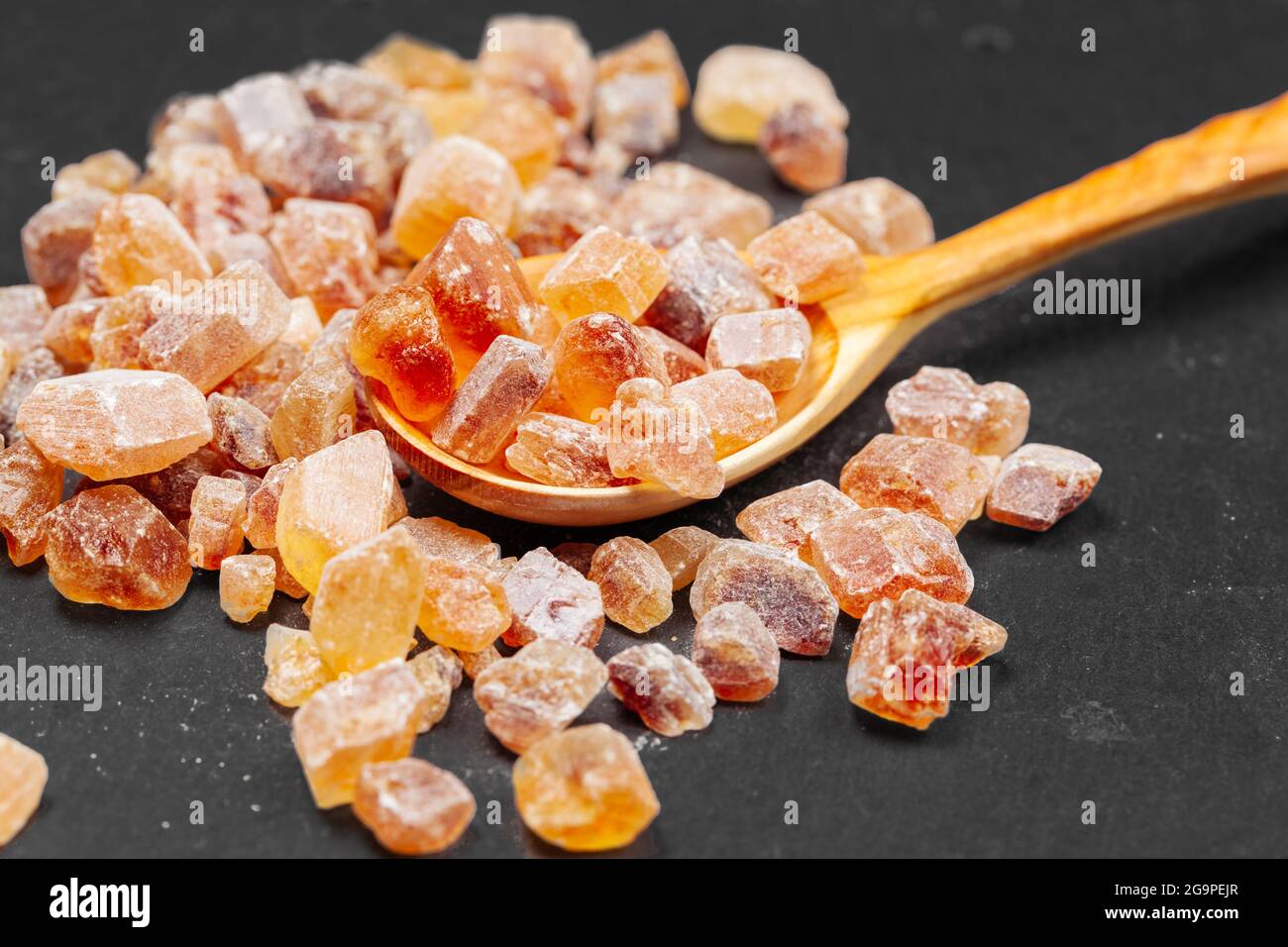 brown sugar rock organic crystalline close up on dark background Stock ...