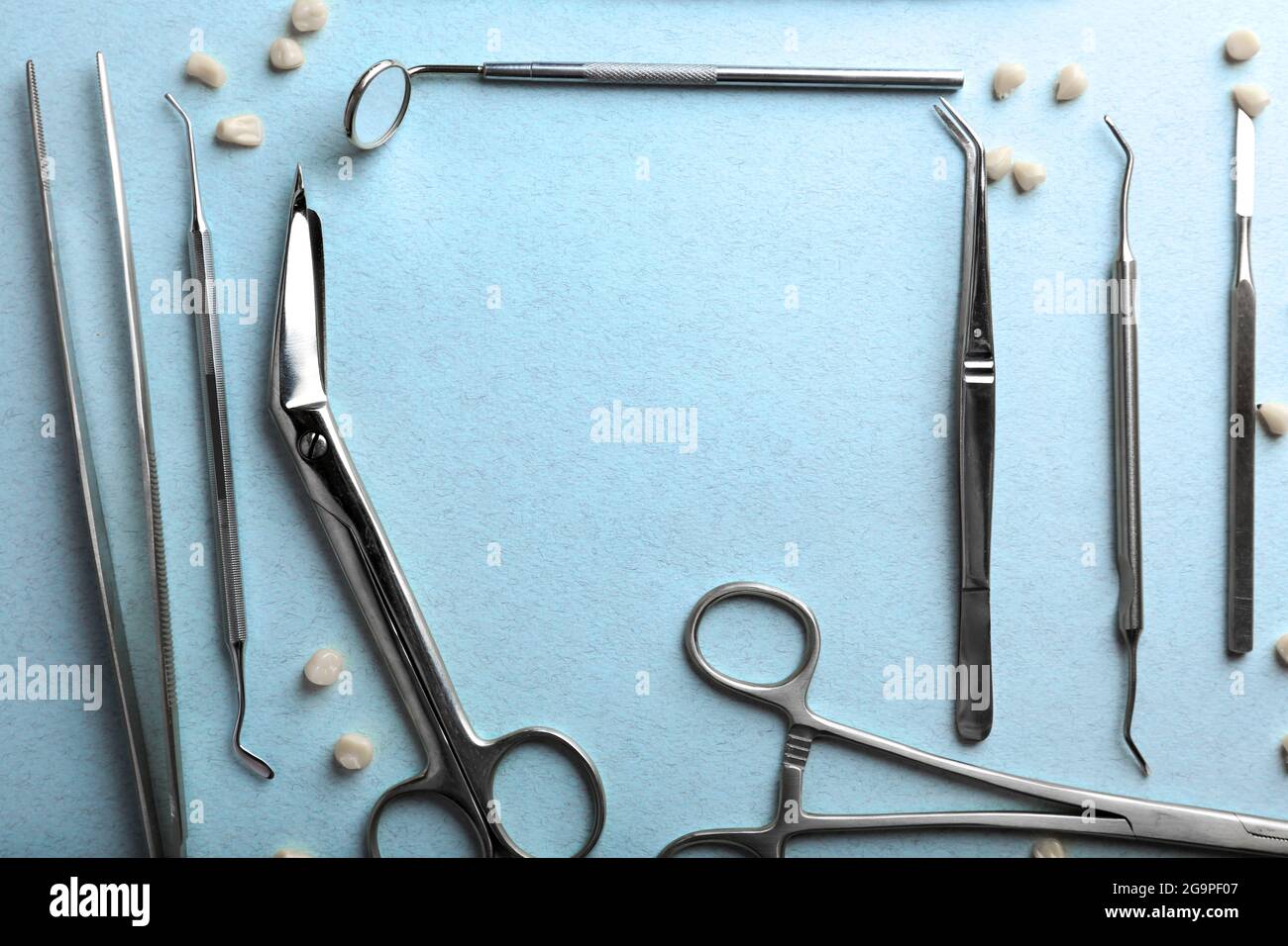 Dentist tools with teeth on light background Stock Photo - Alamy