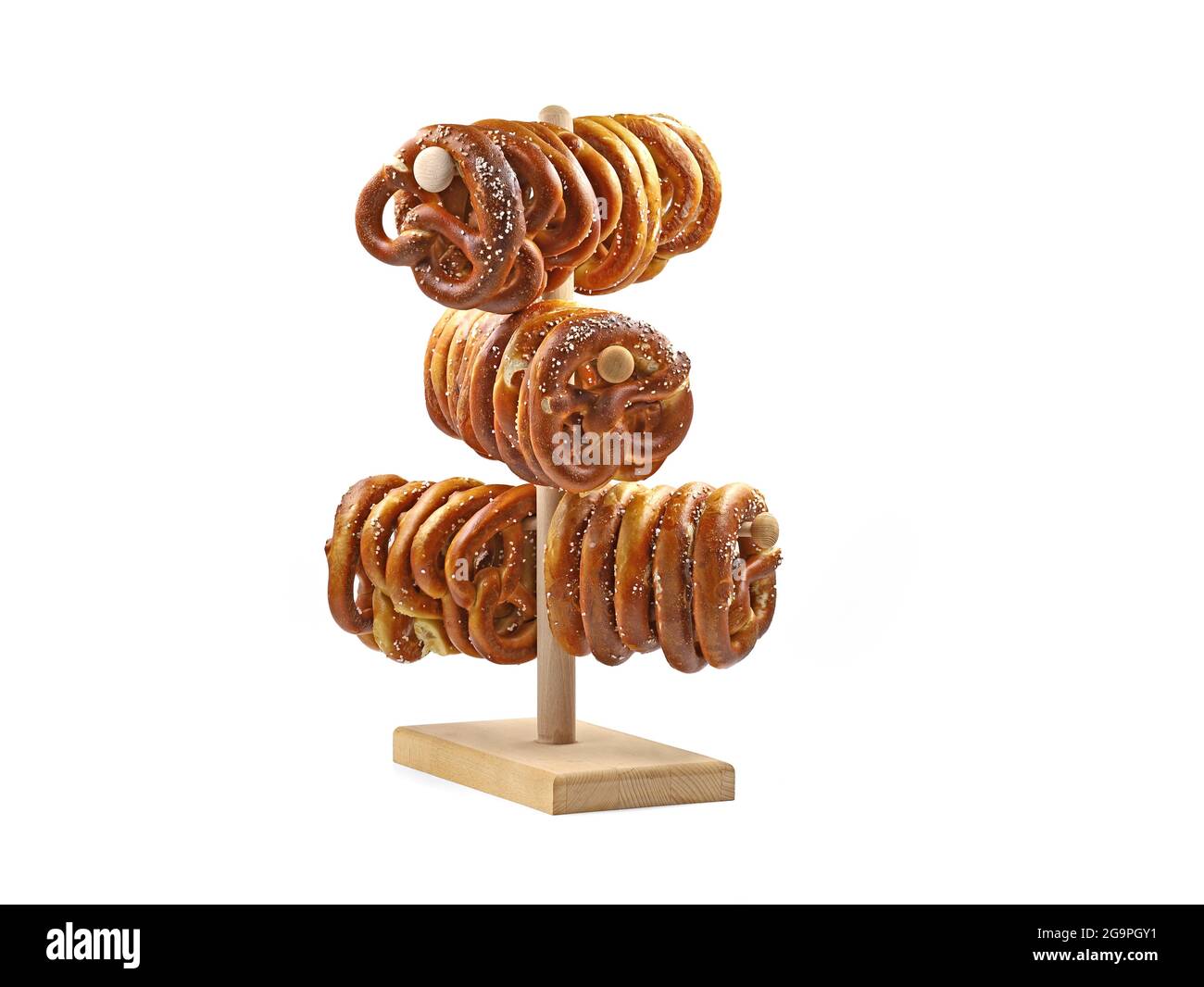fresh baked bavarian pretzel on traditional wooden stand isolated on ...