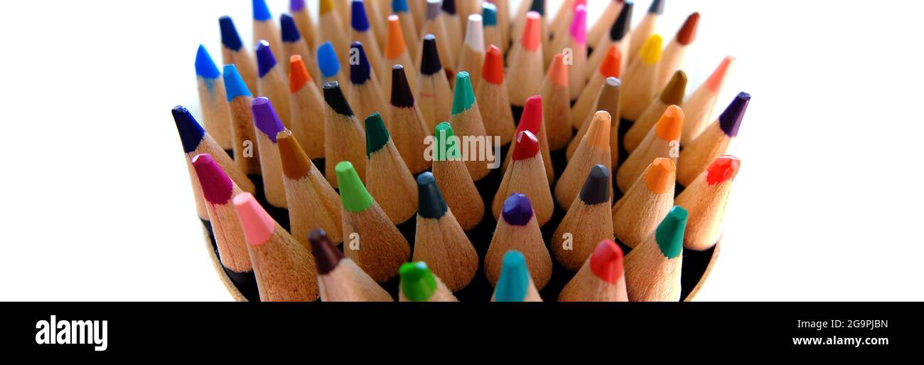 Large pile amount of colored pencils in a tube holder for art and ...