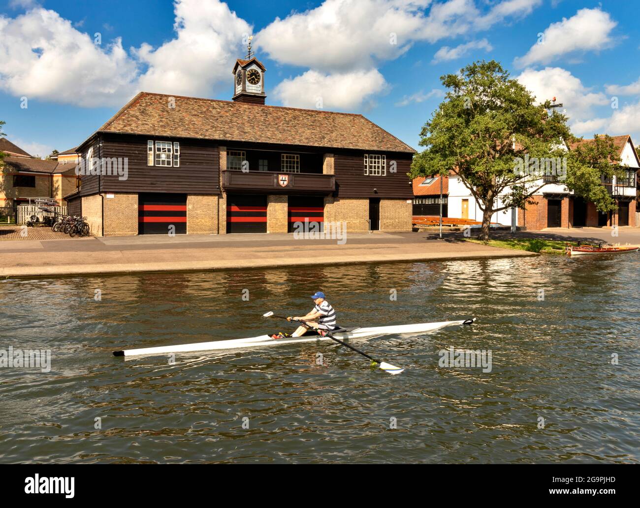 CAMBRIDGE ENGLAND RIVER CAM SCULLER PASSING JESUS COLLEGE BOATHOUSE ...