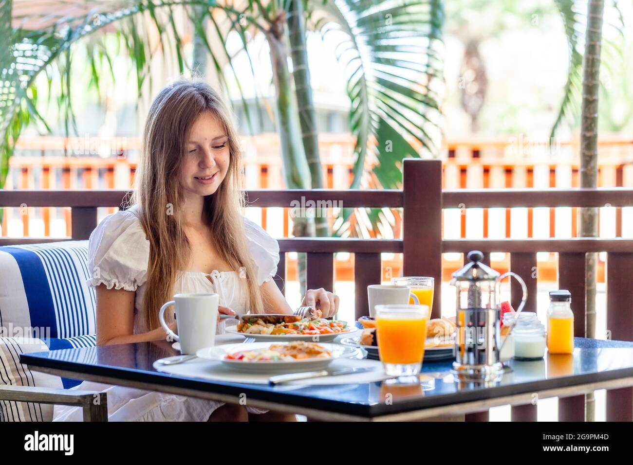 Young Smiling Woman Sitting on Breakfast with Plates Full of Food Stock ...