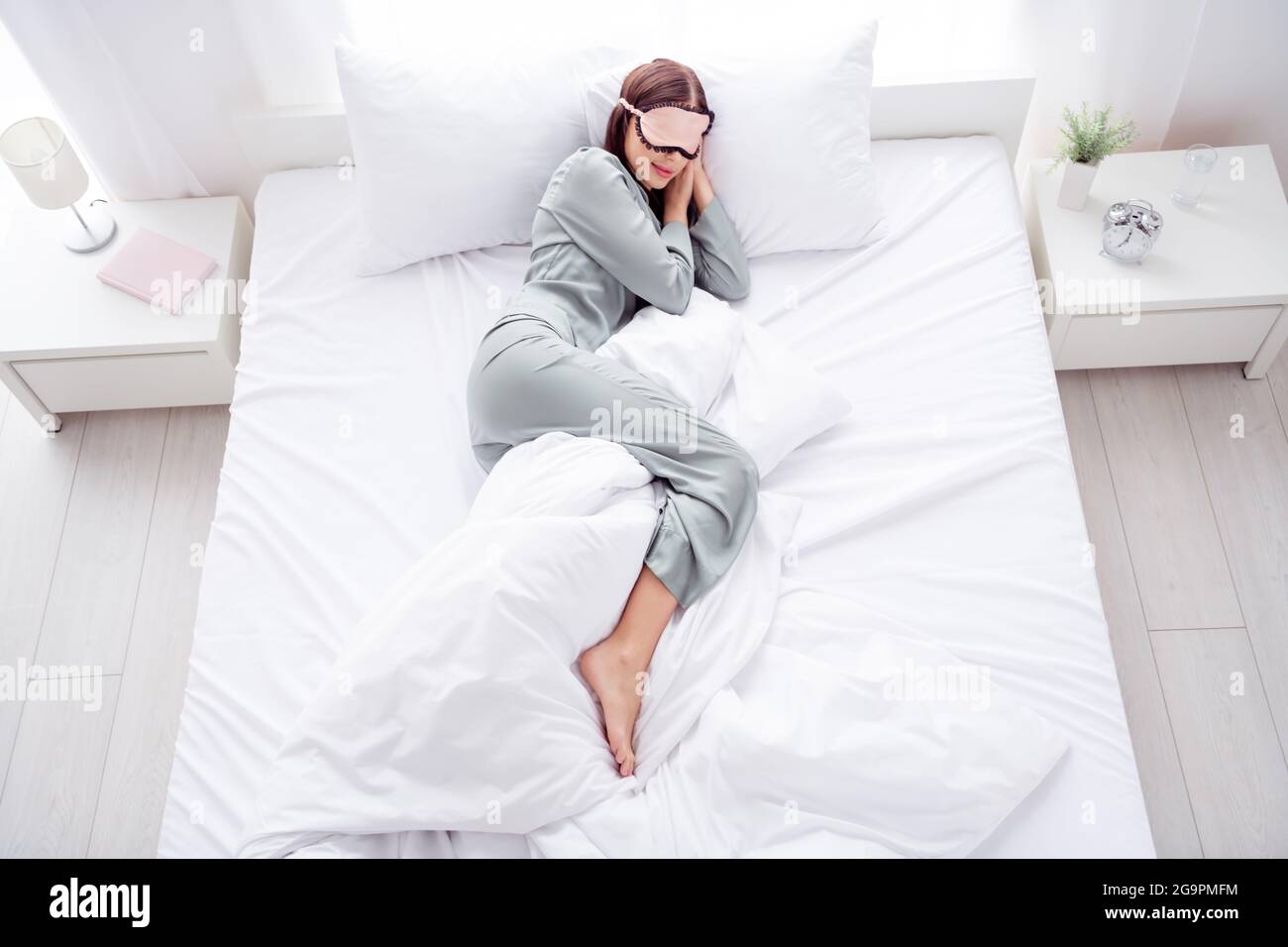 Full length body size photo woman sleeping in bed wearing mask grey ...