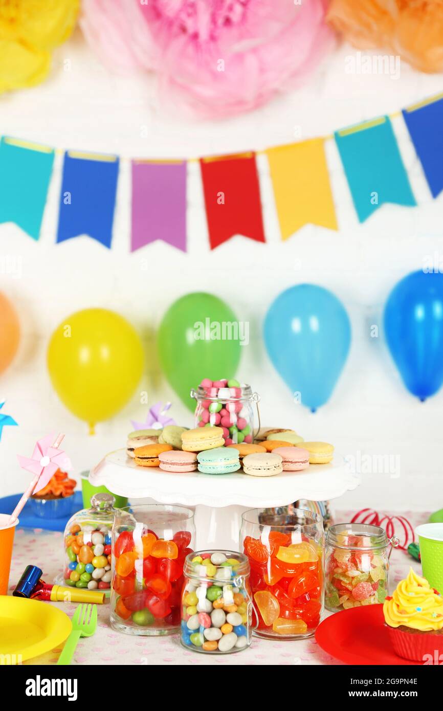Prepared birthday table with sweets for children party Stock Photo - Alamy