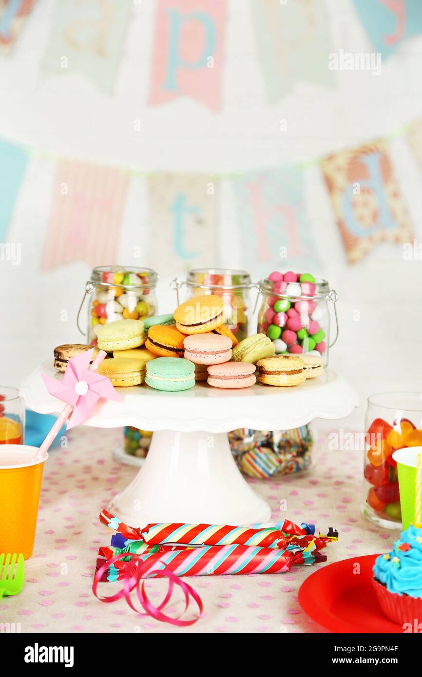 Prepared birthday table with sweets for children party Stock Photo - Alamy