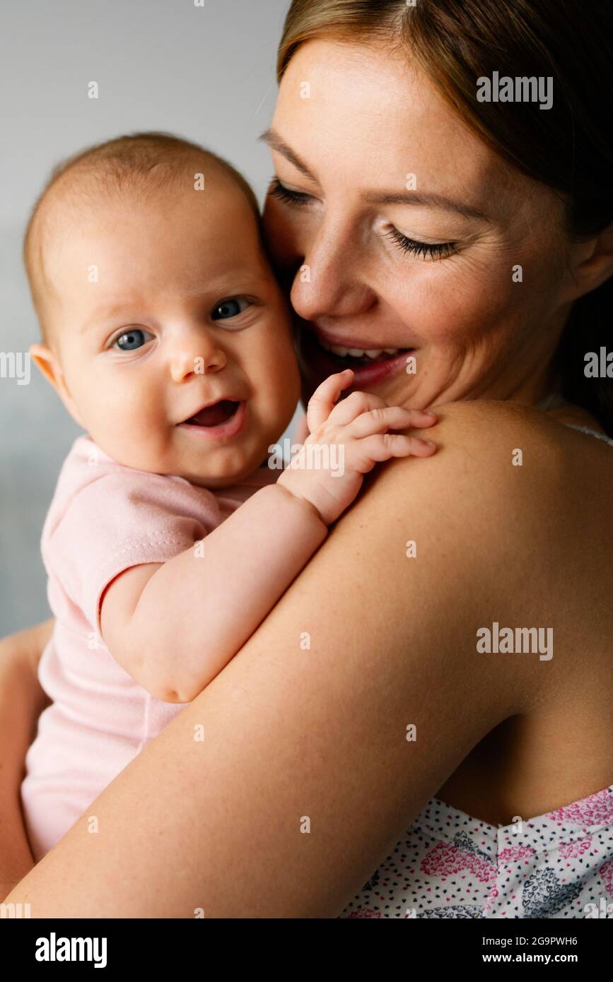 Beautiful mother and her newborn baby together. Love, happiness, family ...