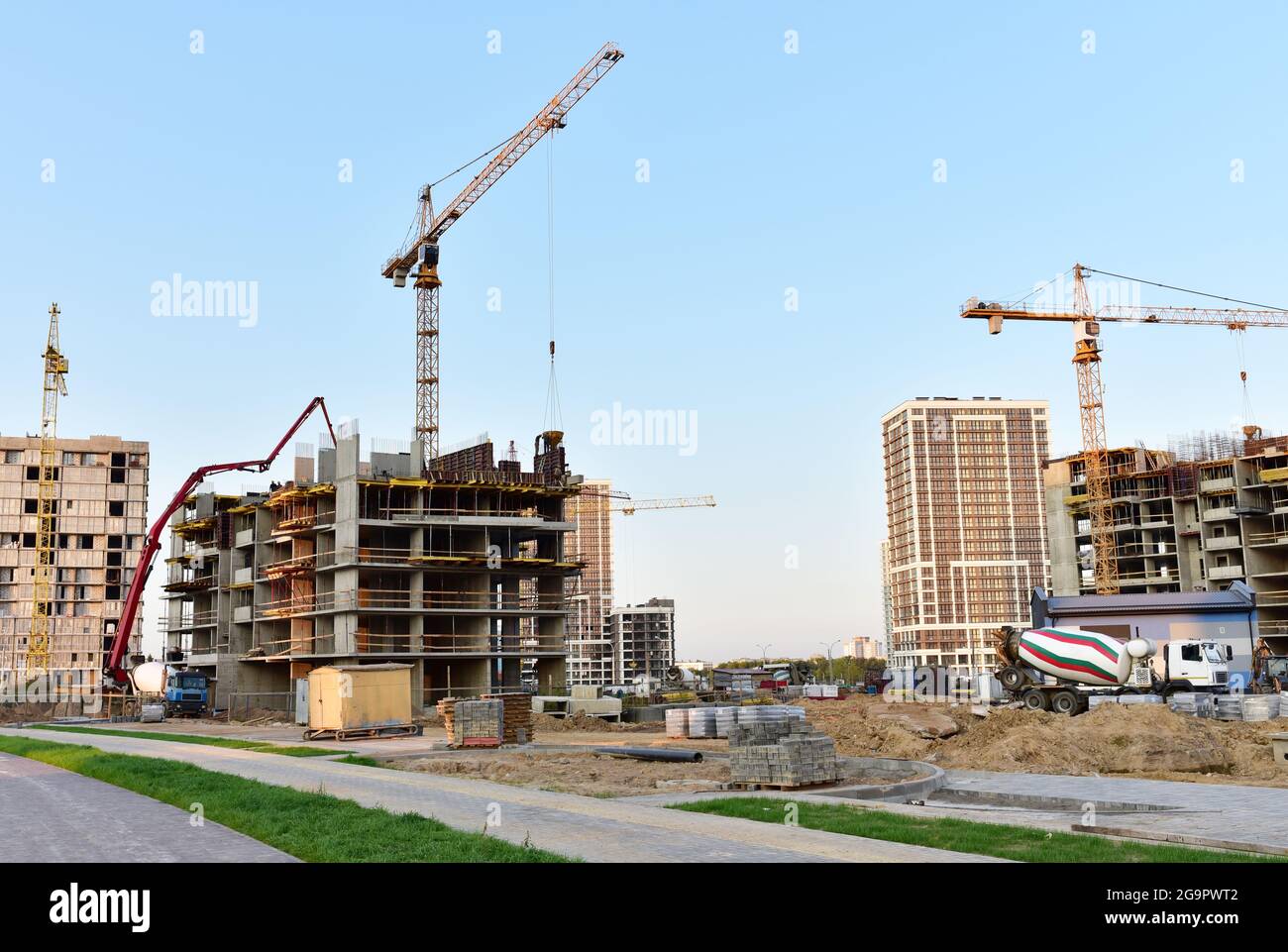 View of large construction site. Tower cranes in action. Formworks and ...