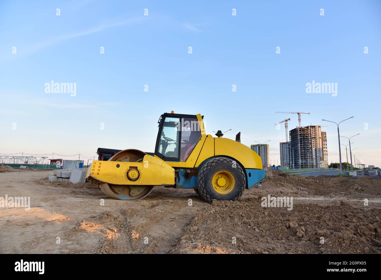 Vibro Roller Soil Compactor leveling ground at construction site ...