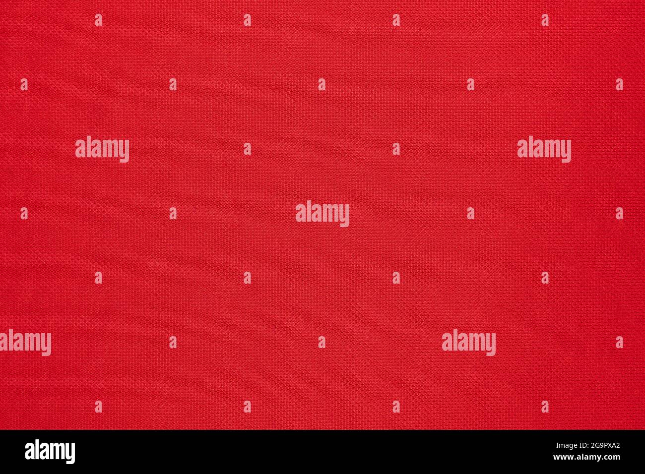 Vibrant red flat fabric made of polyester material. Fabric background ...
