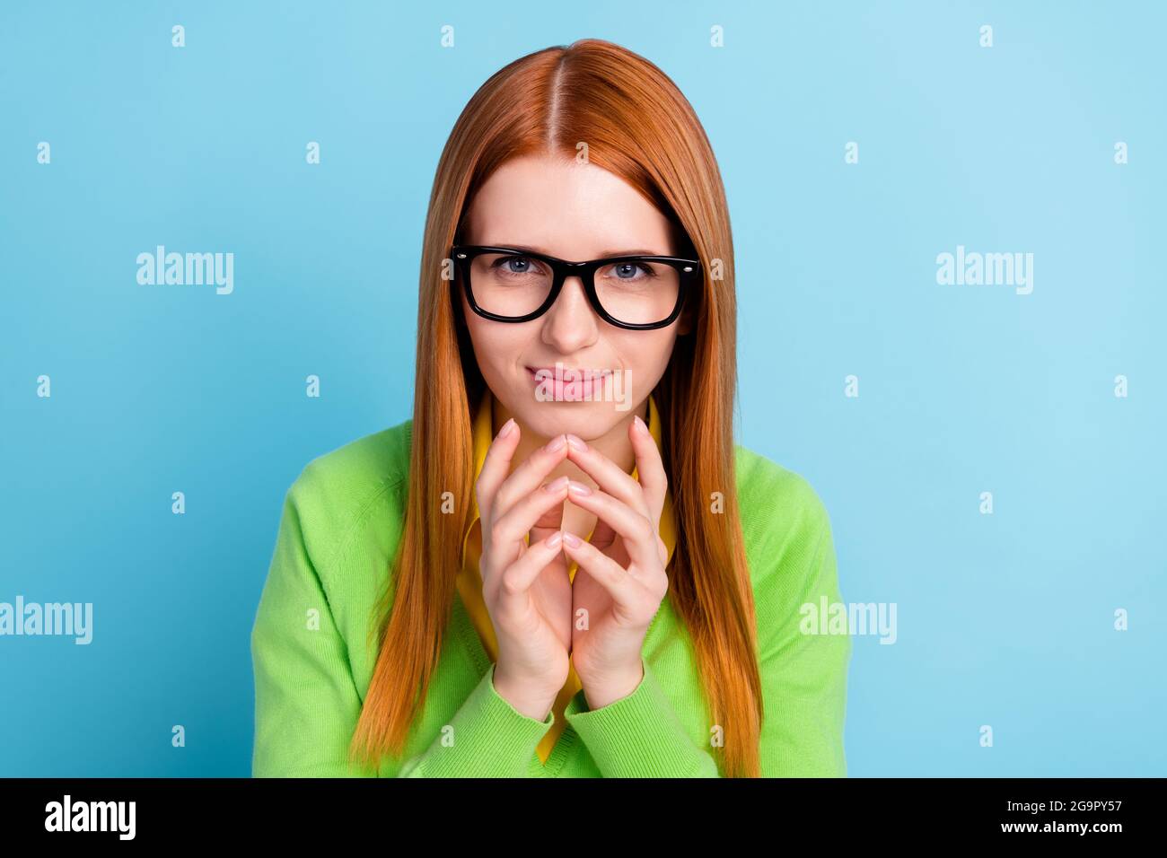 Portrait of attractive wicked cunning red-haired girl making plan ...